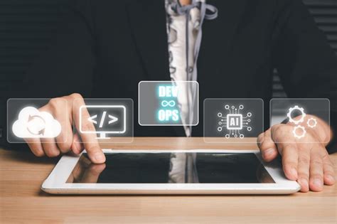 Premium Photo Devops Concept Man Hand Touching Tablet With Devops Icon On Vr Screen On Desk