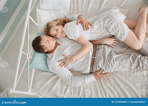 Happy Husband And Wife Lying On The Bed Stock Photo Image Of Husband Maternity