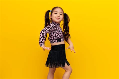Premium Photo Little Asian Girl In Dance Outfit Dances Chachacha On