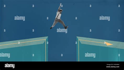 Man Leaping Across Large Gap Between Two Platforms Representing Risk Taking Or Bridging