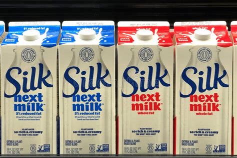 Grocery Store Shelf With Cartons Of Silk Brand Plant Based Next Milk