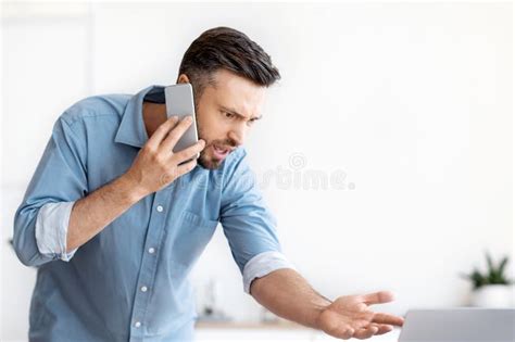 Problems At Work Angry Businessman Talking On Cellphone Having