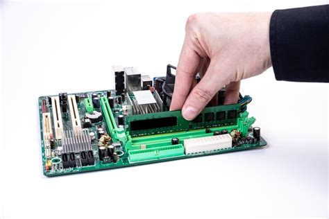 Premium Photo Installing A New Ram Ddr Memory For A Personal Computer Processor Socket In A