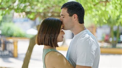 Beautiful Couple Standing Together Kissing At Park Stock Image Image Of Town Casual