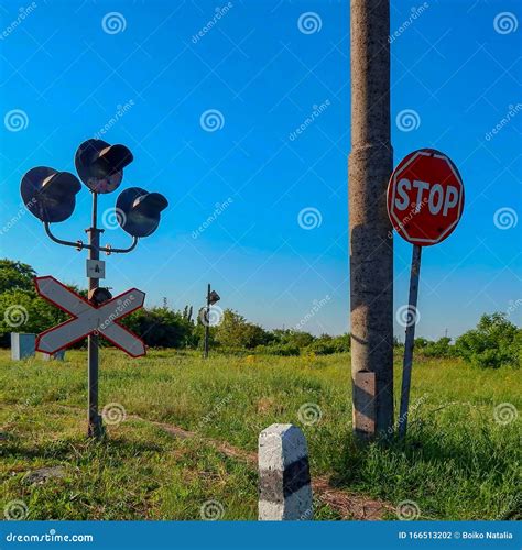 Semaphore On The Move With A Stop Sign Railroad Crossing Signal Lights Against A Blue Sky Stock