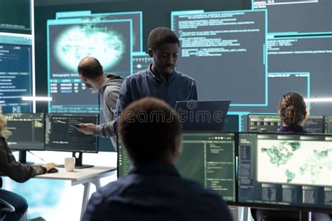 Governmental Hackers Working On Computer Network In High Tech Office