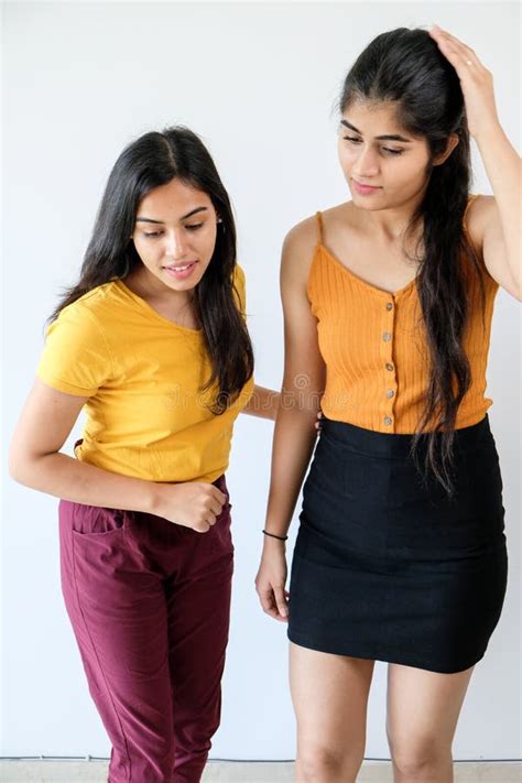 Vertical Closeup Of Two Girls Looking Down Stock Image Image Of