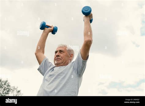 Senior Man Working Out Outdoors Person Lifting Dumbbells Old Male