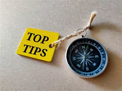Selective Focuscompass And Wooden Board With Text Top Tips Shot Were