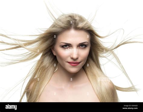 Portrait Of A Beautiful Blonde Woman With Hair Fluttering In The Wind