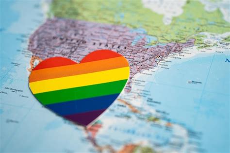 Premium Photo Rainbow Color Heart On Globe World Map Background