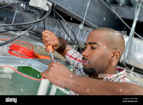 Electrician Using Cable Cutters Stock Photo Alamy