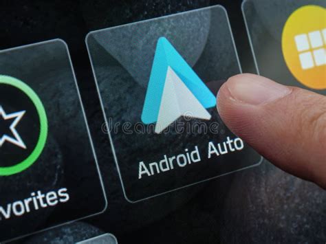 Close Up Of A Finger Activating The Android Auto Application On A Modern Car S Infotainment