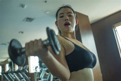 Mirror Portrait Of Young Pretty And Fit Asian Japanese Woman Working