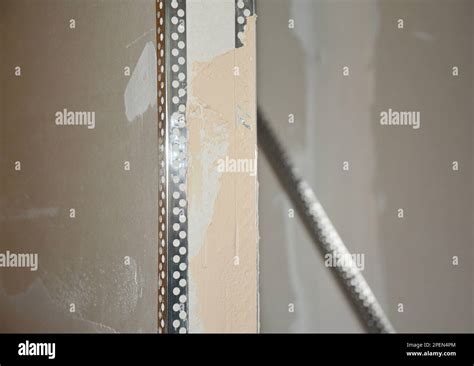 Drywall Partition Construction Close Up On Skim Coating Finishing Applying The First Coat Of