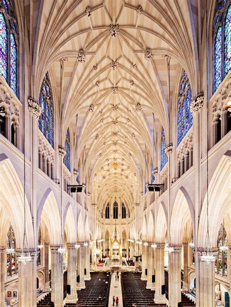 Stunning Cathedral Interior With Pews And Stained Glass Windows