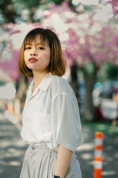 Premium Photo Portrait Of Girl Standing Outdoors