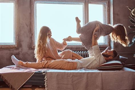 Mom Dad And Daughter In Bed Father Playing With Adorable Daughter In