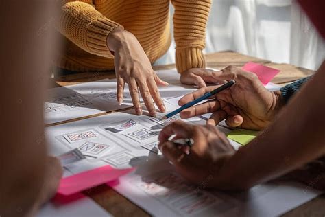 ux devs and ui designers at office brainstorm app interface design