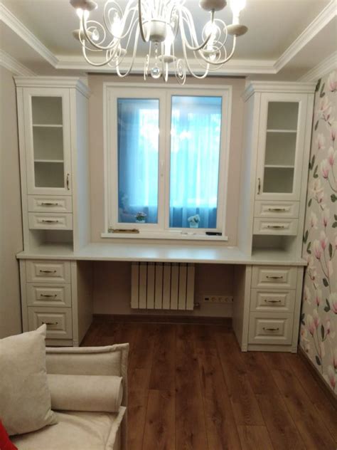 Письменный стол со стеллажами возле окна Адалит Мебель