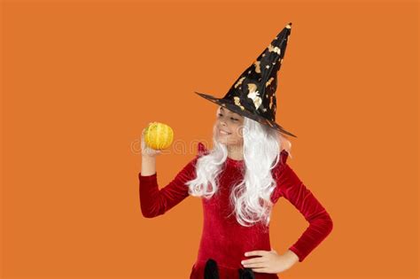 Halloween Witch Girl Isolated On Orange Pumpkin On Halloween Witch