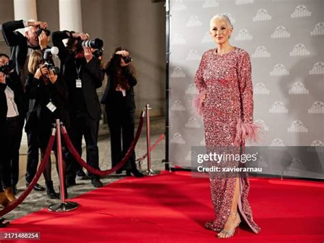 Elegant Celebrity Posing In Front Of Step And Repeat Wall High Res