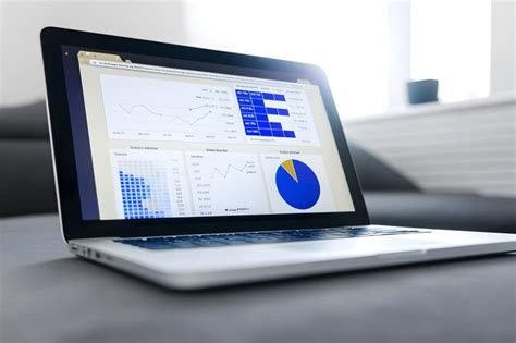 Open Laptop With Data Analysis And Charts Displayed On The Screen