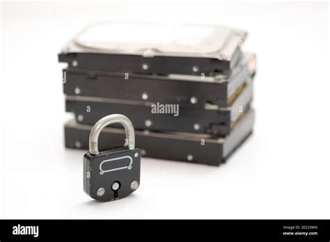 Computer Hard Disks And Metal Padlock Symbolizing Concept For Encrypted Data Cyber Security On