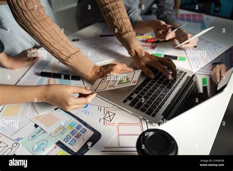 Creative Ux Ui Design Process With Team Collaborating On Mobile App Interface Prototypes And