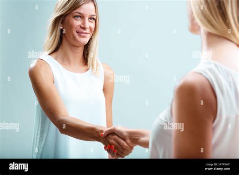 Business Deal Between Two Blonde Women Testament To The Prowess Of