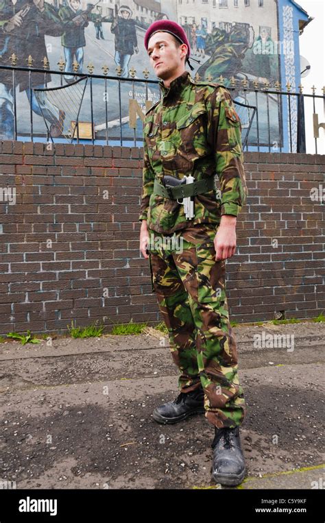 Youth Dressed As Soldier From 3rd Parachute Regiment Stands In Front Of