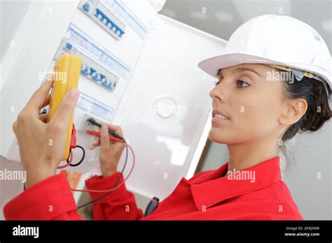 Woman Inspecting Voltage Of An Electrical Box Stock Photo Alamy