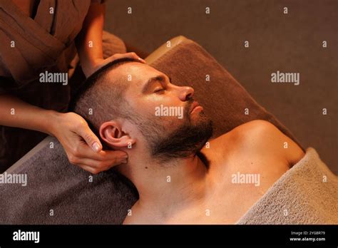 Girl Massage Therapist Gives Head Massage To Man In Office With Warm
