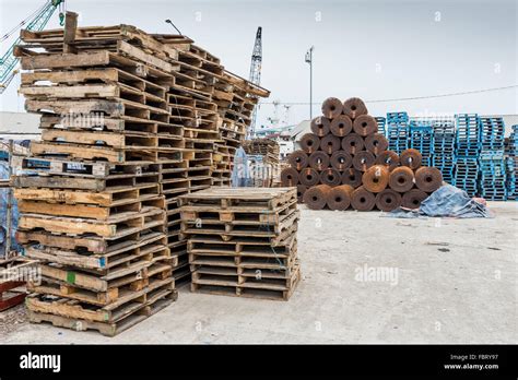 Stacks Of Pallets And Coils Of Steel Matting Piled Up At Jakarta Old Harbour Stock Photo Alamy