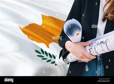 Cypriot Architect Woman Holding Blueprint Against Cyprus Waving Flag Background Construction