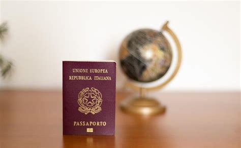 Premium Photo A Passport And A Globe On The Table