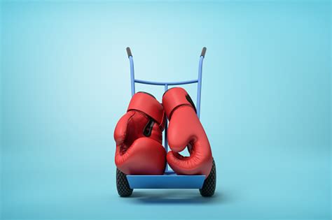 복사 공간이있는 밝은 파란색 배경에 반 턴에 서있는 파란색 손 트럭에 큰 빨간 권투 장갑 쌍의 3d 렌더링 0명에 대한 스톡 사진 및 기타 이미지 Istock
