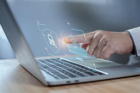 Human Hand Working On Computer And Protection Icon Represents The Code