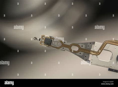 Macro Photo Of Hdd Read Write Head And Disk Platter Behind Visual