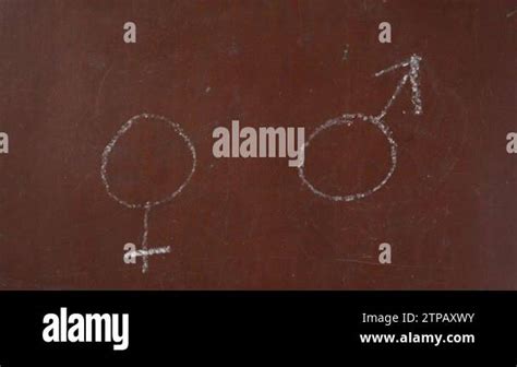 Textured Brown Chalkboard Background Male Hand Drawing Not Equal Symbol Between Two Gender