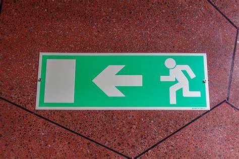 Premium Photo Low Angle View Of Exit Sign On Wall