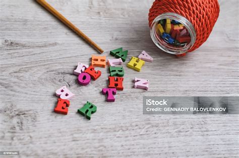 Multicolored Letters Of The Alphabet Container For Letters And A School