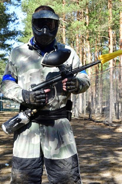 Premium Photo Man Holding Weapon On Field