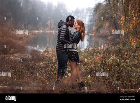 Interracial Couple Posing In Autumn Leaves Background Black Man And