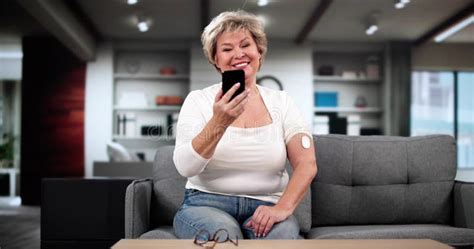 Woman Testing Glucose Level With Continuous Glucose Monitor Stock Image Image Of Checkup