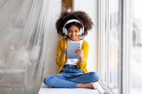 Premium Photo Happy Black Preteen Girl Enjoying Brand New Digital Tablet