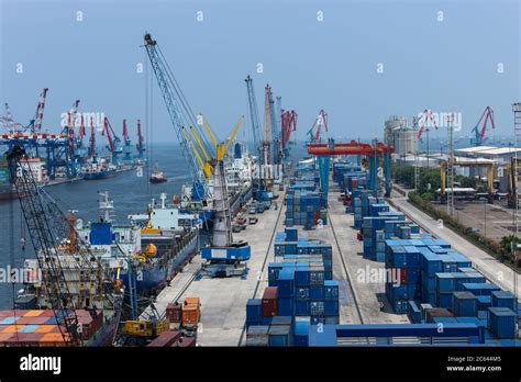 Loading Unloading Shipping Cargo With Industrial Crane Export And Import Sea Transportation