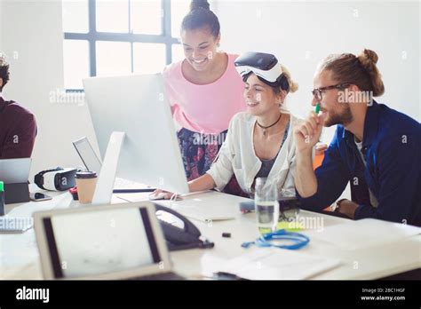 Computer Programmers Programming Virtual Reality Simulator Glasses At