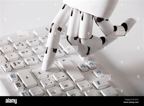 Close Up Of Robotic Hand Pressing Enter Key On Keyboard Stock Photo Alamy