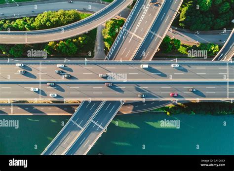Aerial Of Vehicles Navigate A Complex Highway System Showcasing